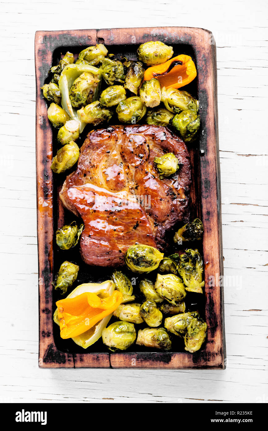 Grilled meat steak medium rare on cutting board.Grilled meat with ...