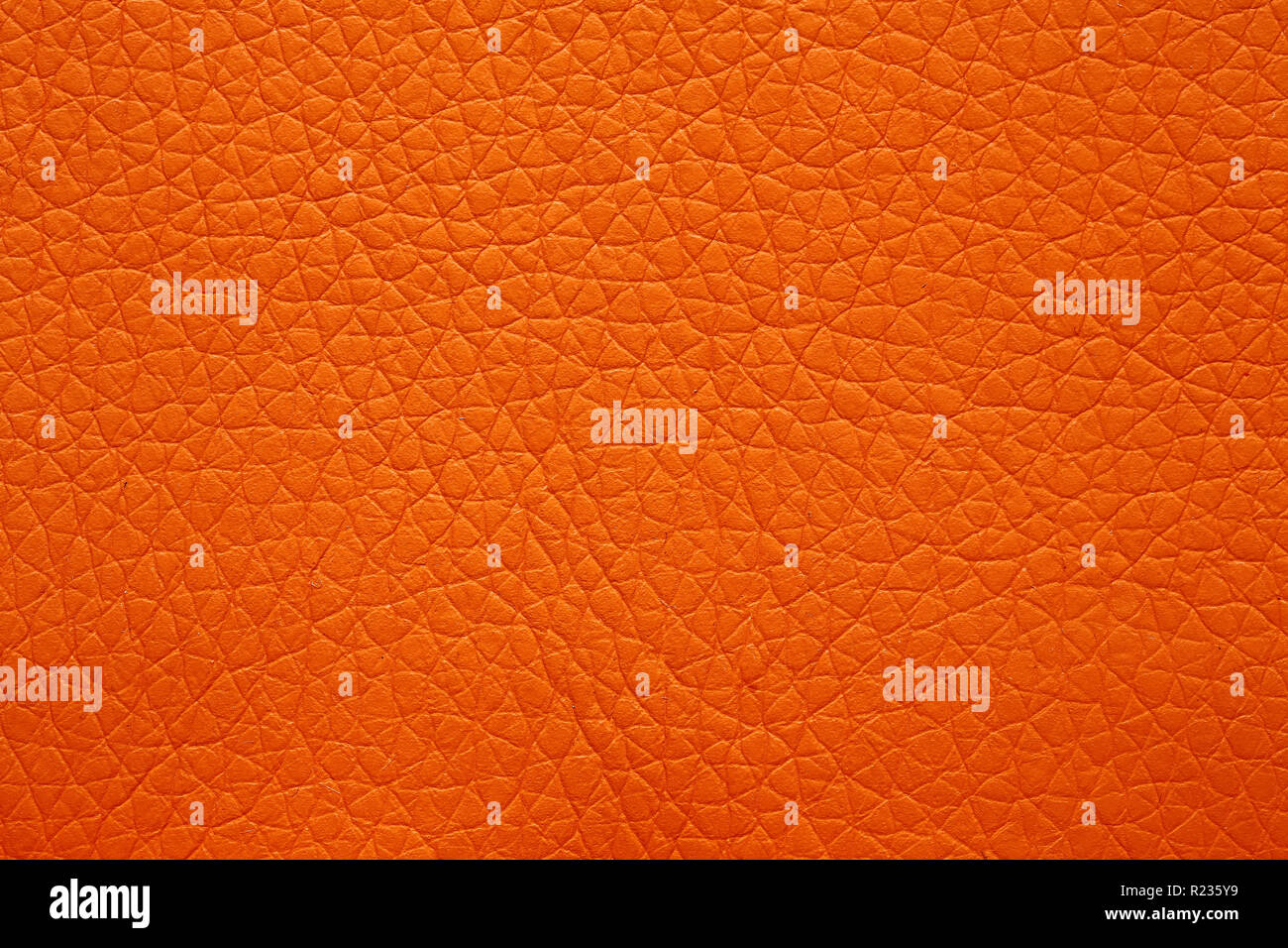 Leatherette texture in magnificent orange colour. Bright orange leather ...