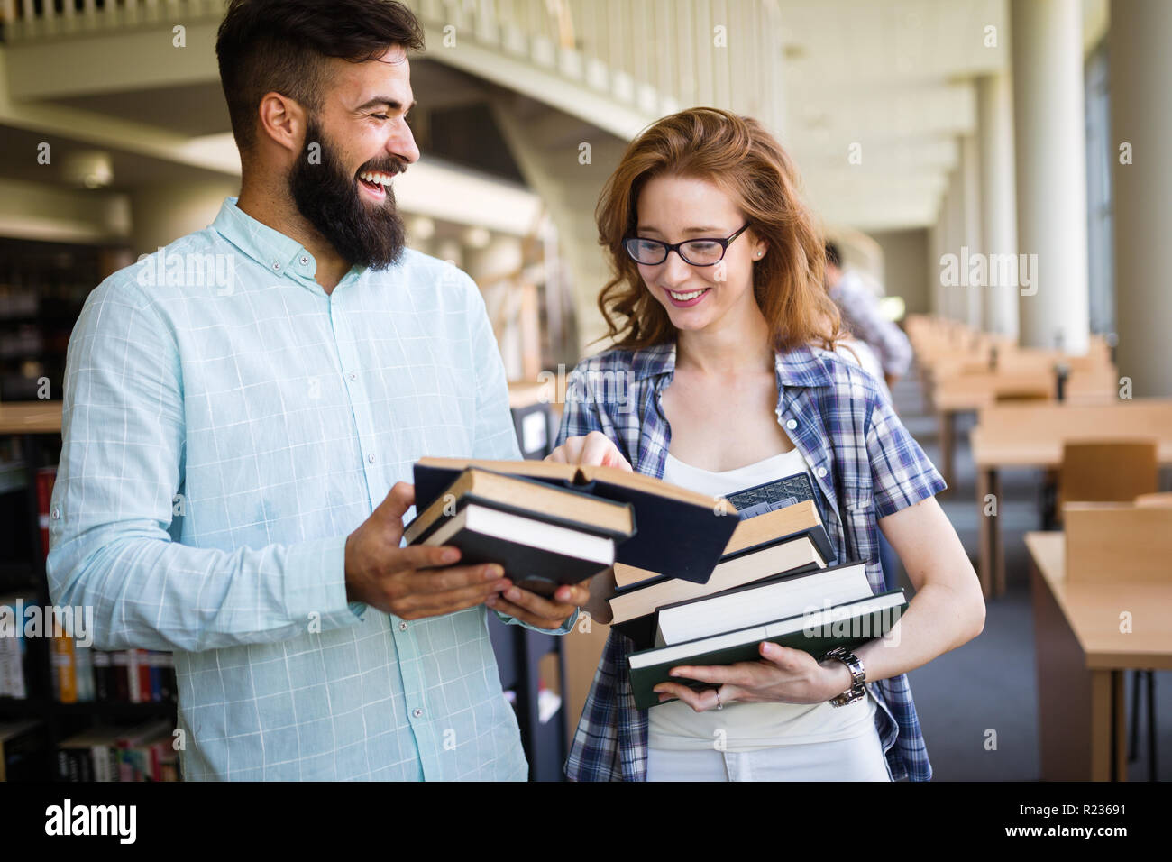 People studying together in a modern library Stock Photo - Alamy