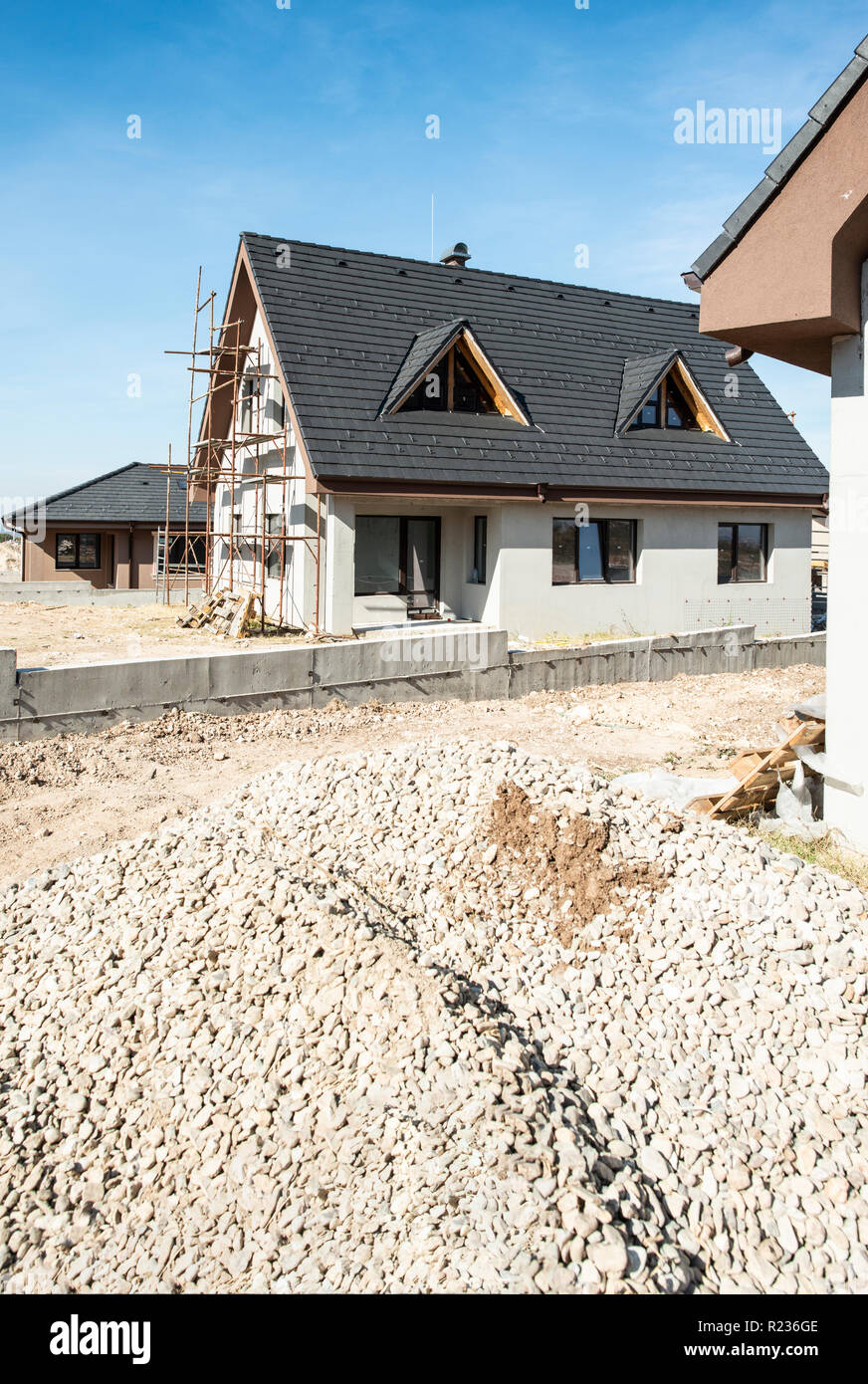 New build houses. Stones heap Stock Photo - Alamy