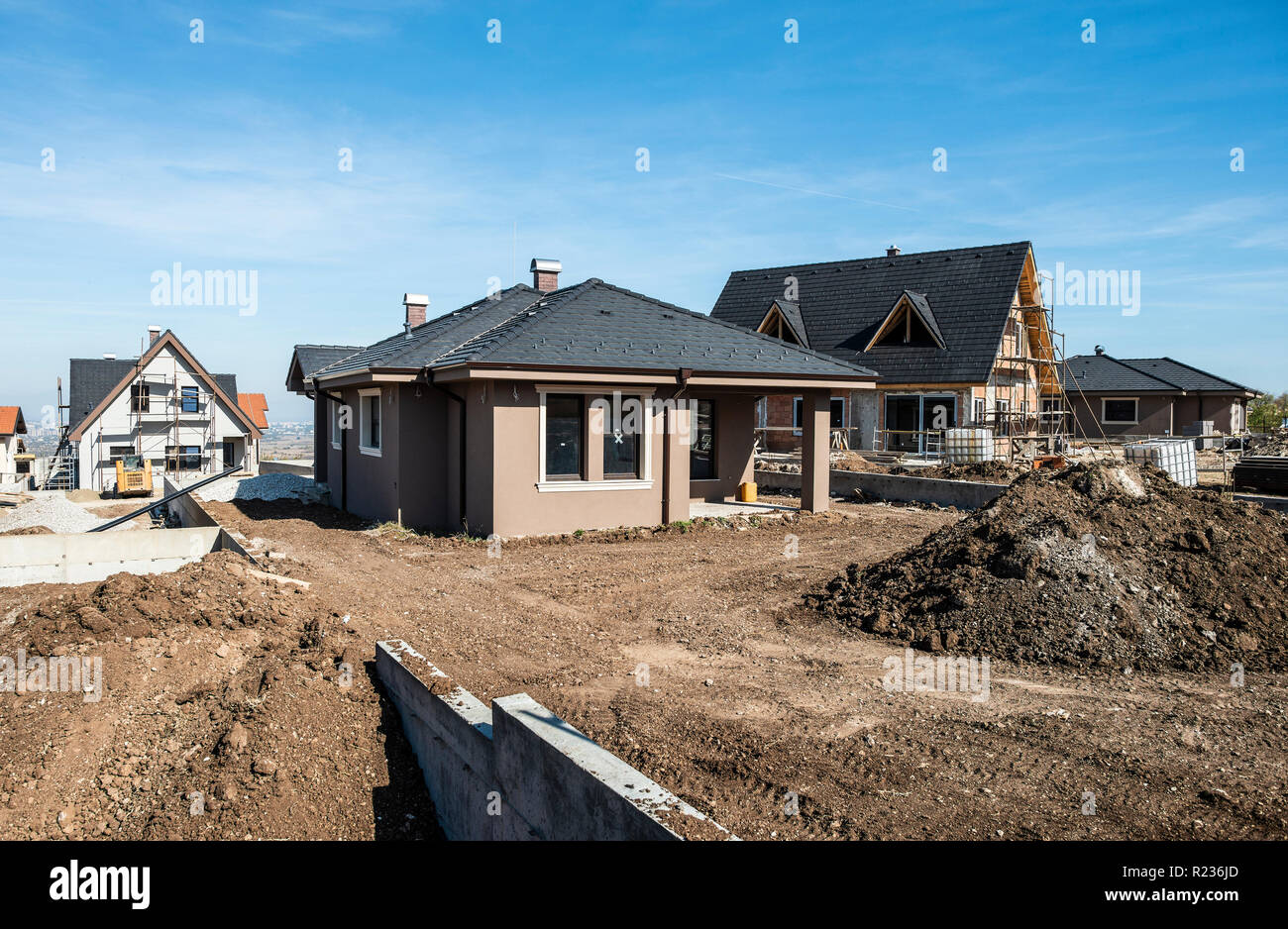 New build houses. Sunny day. Construction site Stock Photo - Alamy