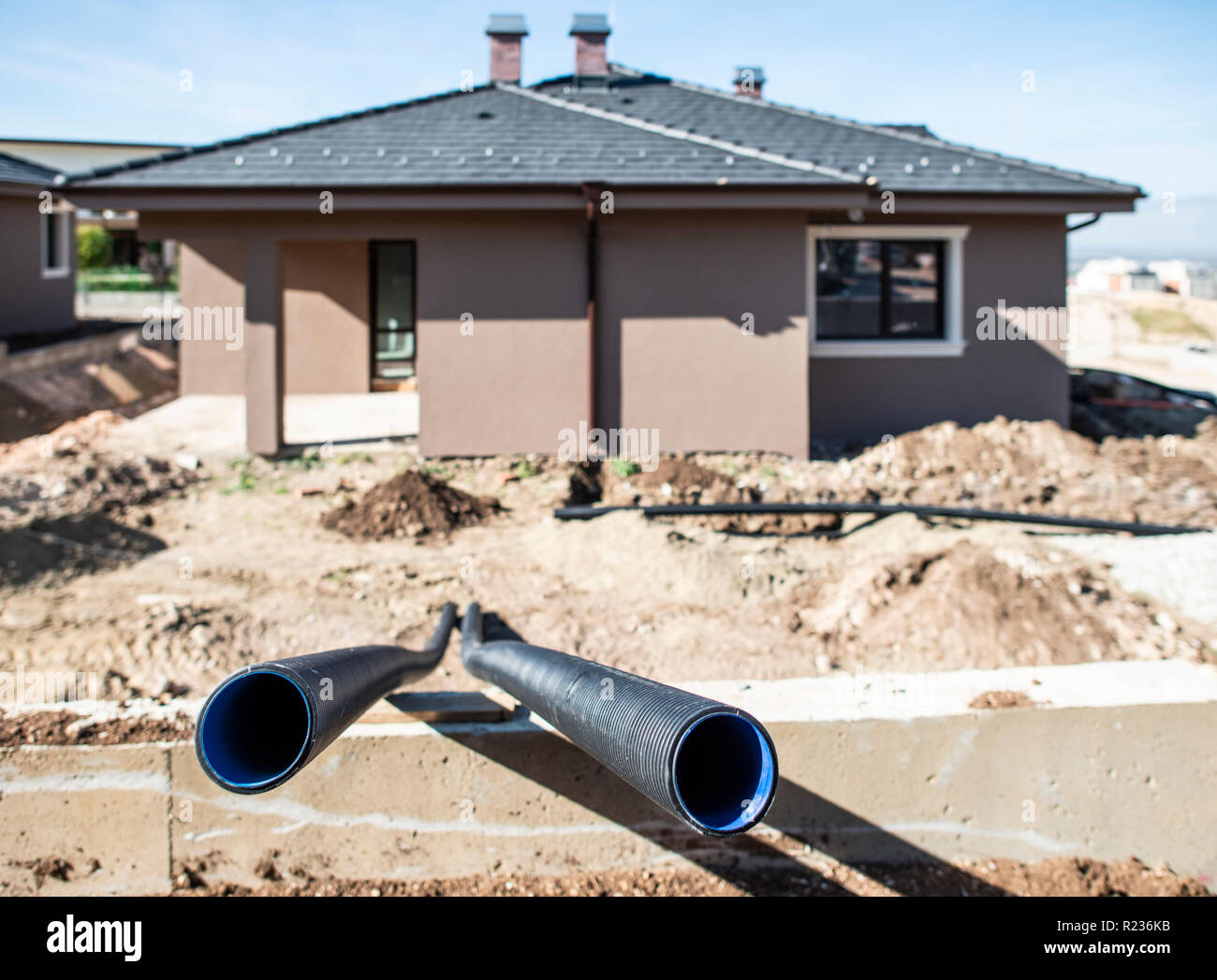 Pipes in new build house. Sunny day Stock Photo - Alamy