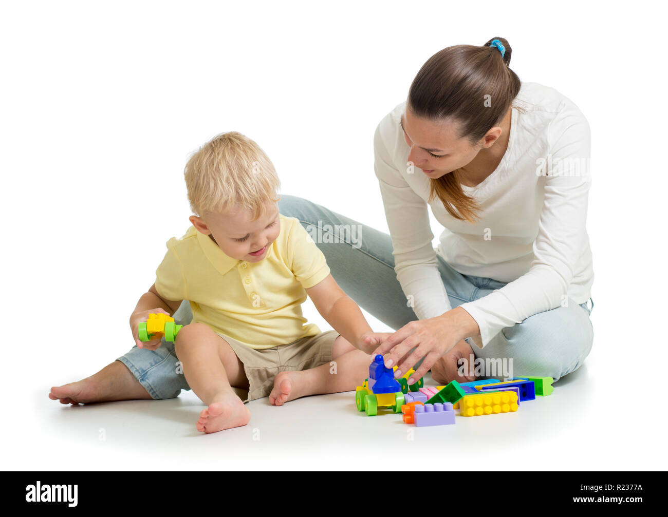 Family playing together. Mom and son play building block toys. Mother ...