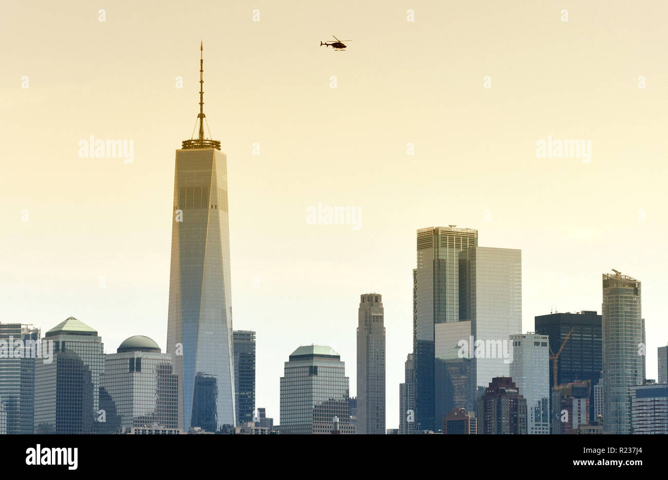 Helicopter fly over the skyscrapers of financial district in lower ...