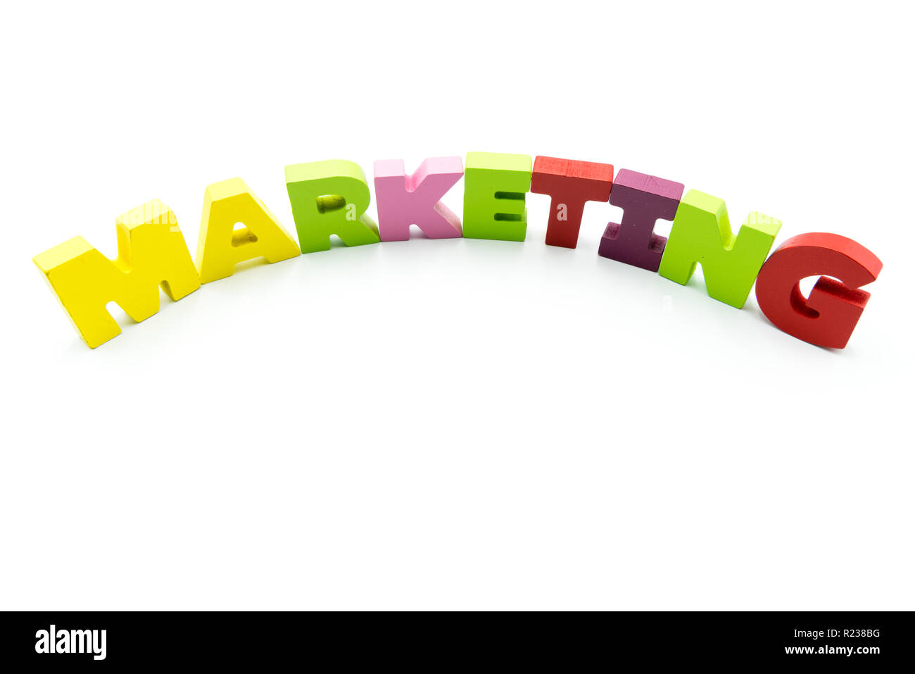 Word MARKETING written with colourful wooden letters, isolated over ...