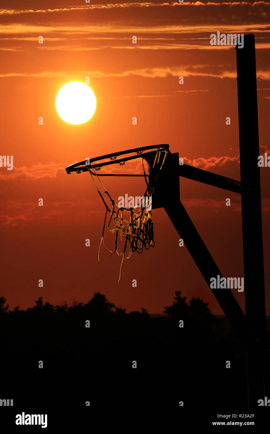 Silhouette Of Basketball Rim At Sunset Stock Photo - Alamy