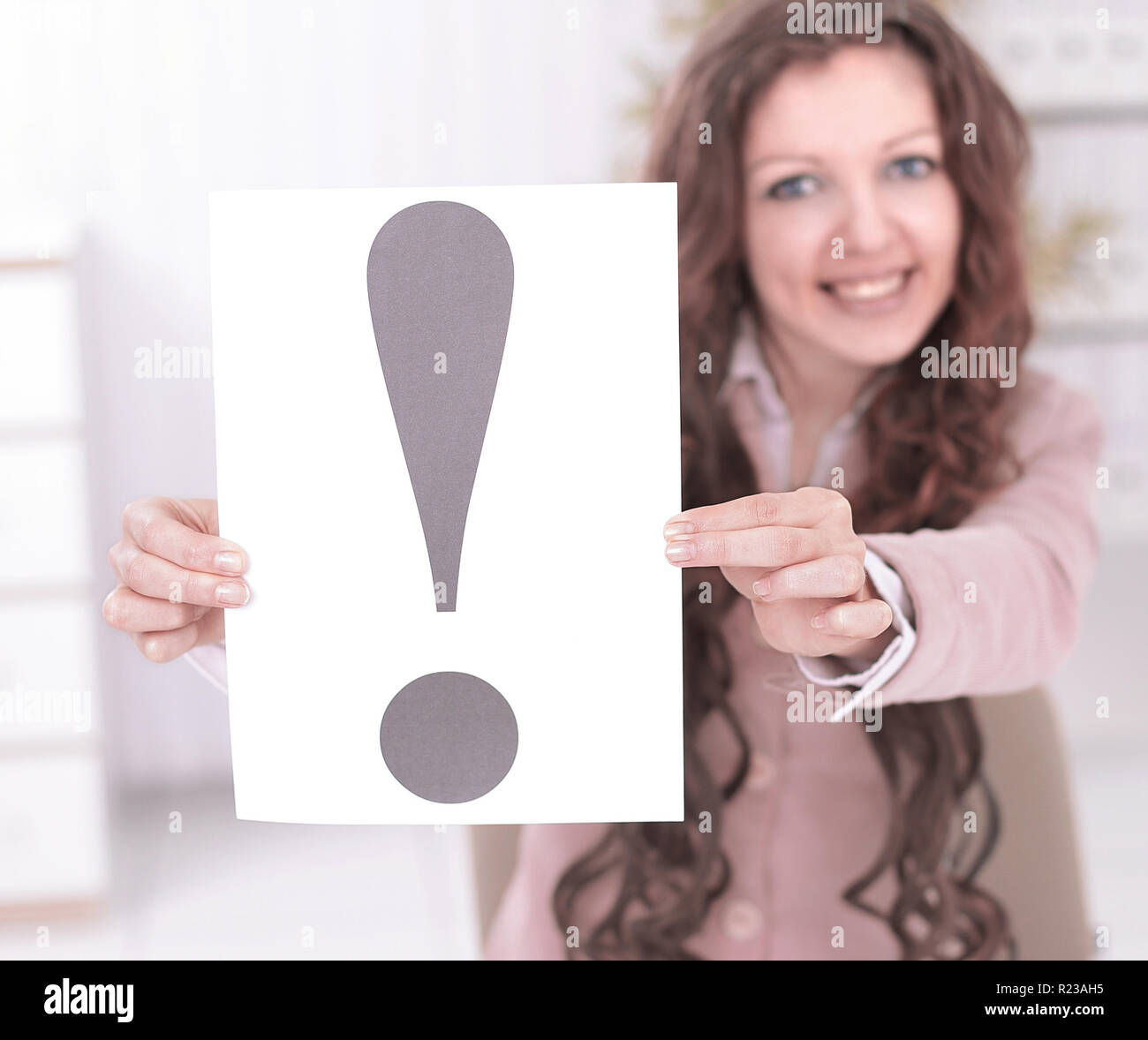 young business woman showing poster with an exclamation point Stock ...