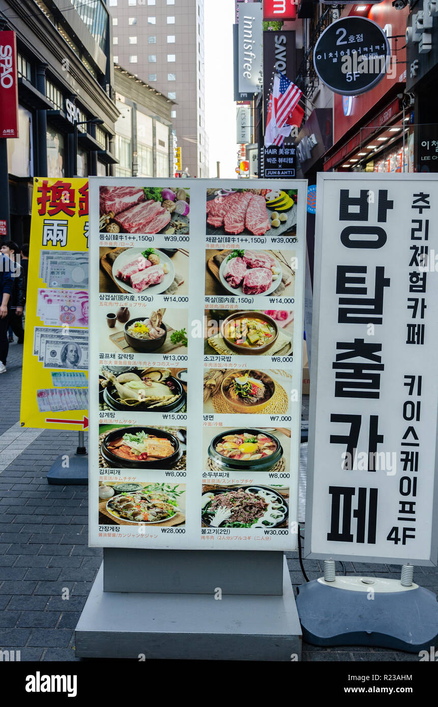 A menu board outside a restaurant in Myeongdong in Seoul, South Korea ...