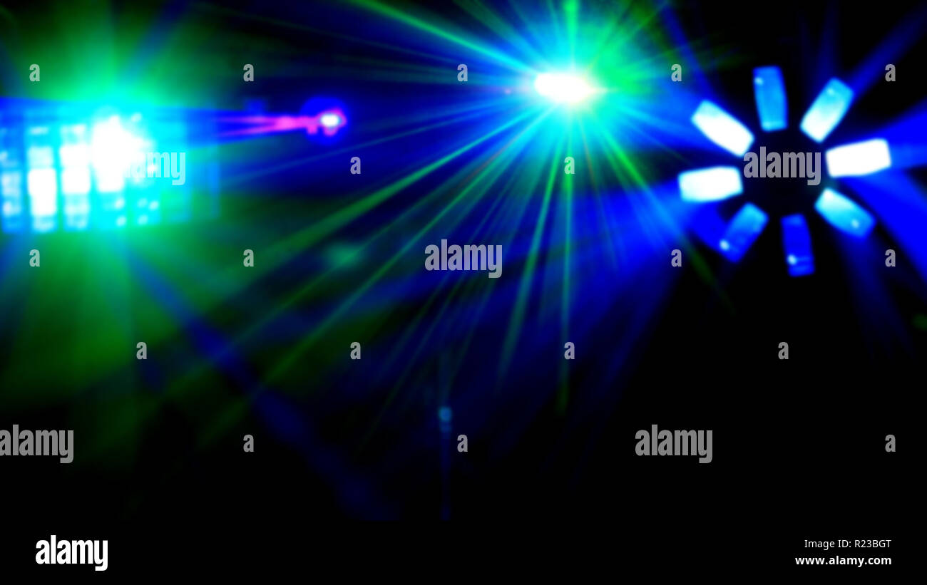 Laser beams with bright lights on disco in blur Stock Photo - Alamy