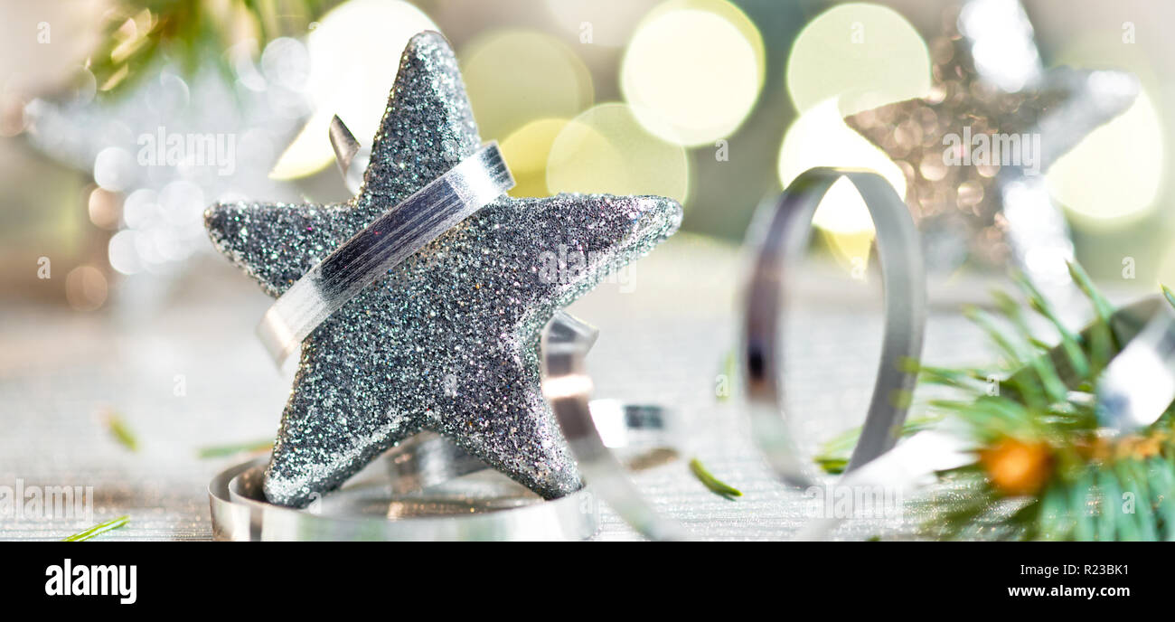 Christmas star and glitter on unfocused background Stock Photo - Alamy