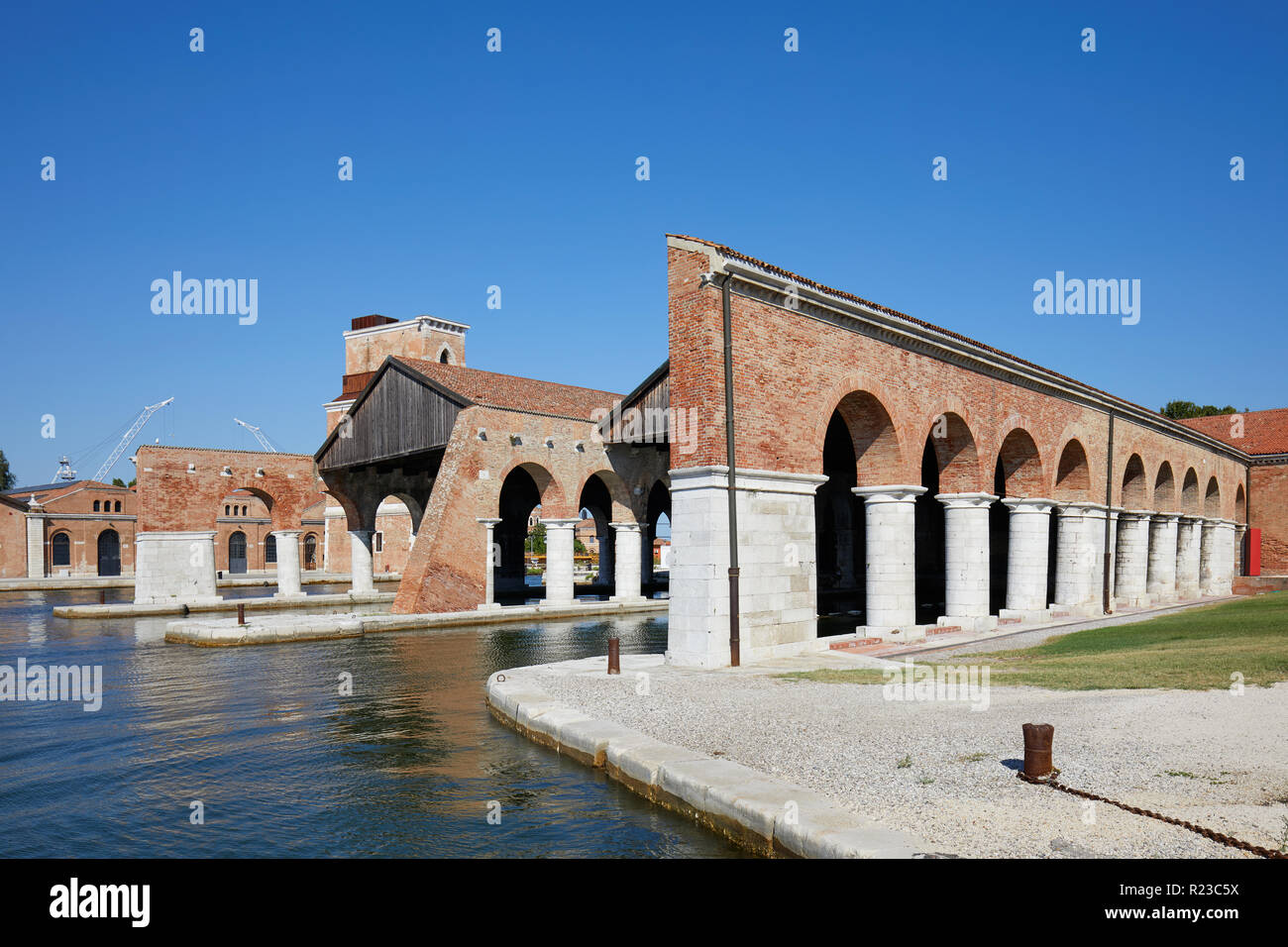 Venetian Arsenal with docks and arcade in a sunny day in Venice, Italy ...