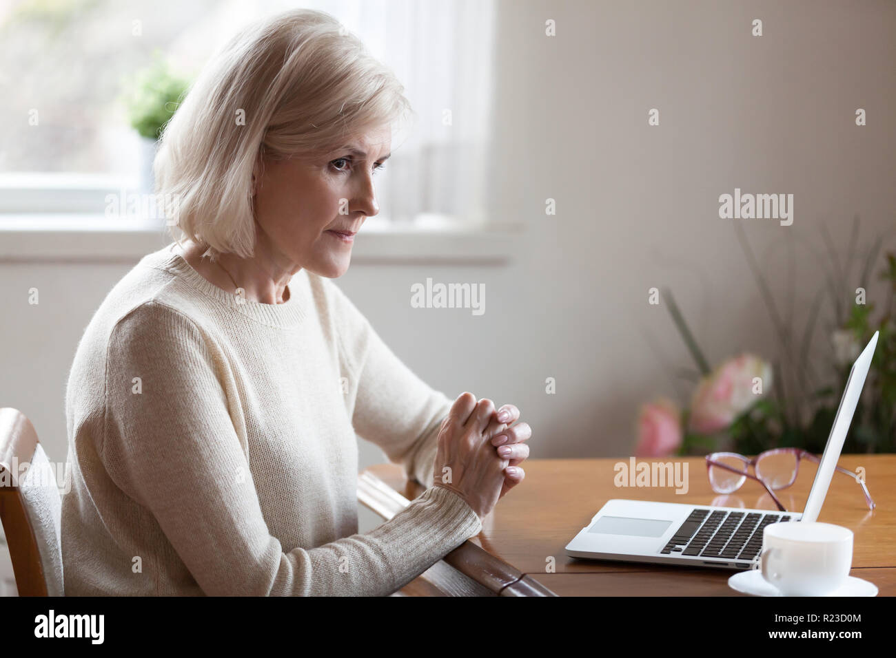 Serious lady thinking something hi-res stock photography and images - Alamy