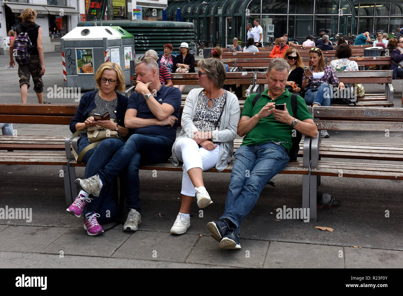 People sitting on public bench seats Vienna, Austria Stock Photo - Alamy