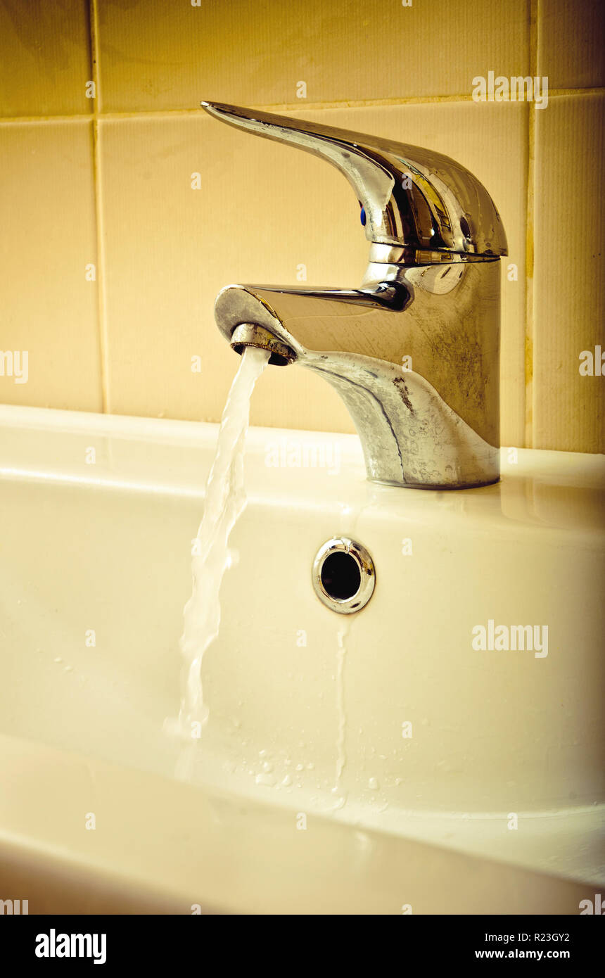 old tap with flowing water Stock Photo - Alamy