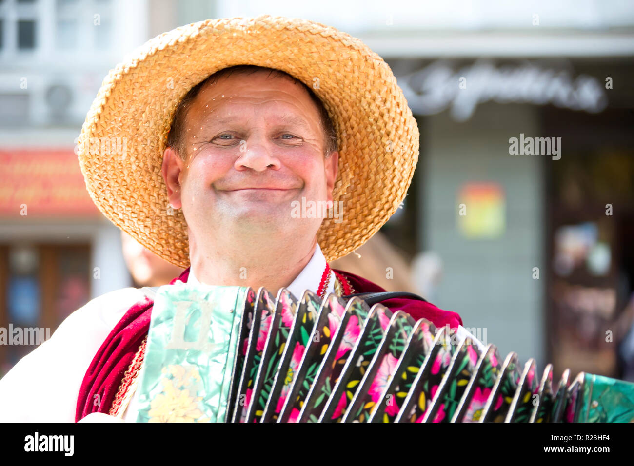 Old person playing harmonica hi-res stock photography and images - Alamy