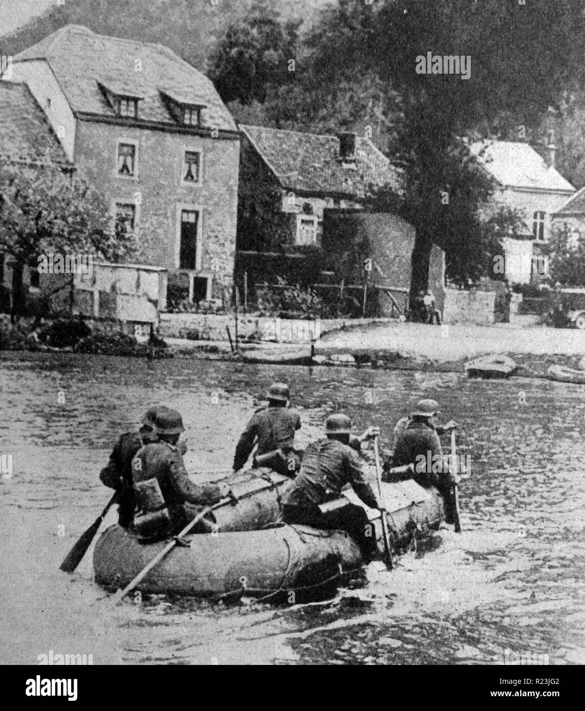 Photograph of Nazis paddling a rubber boat across a river in Belgium ...