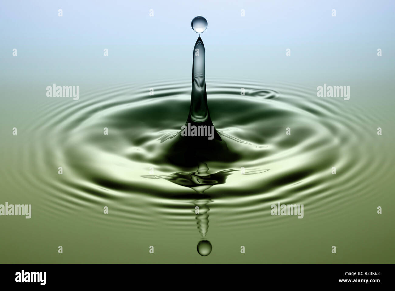 Green water splash. Falling drop of water Stock Photo - Alamy