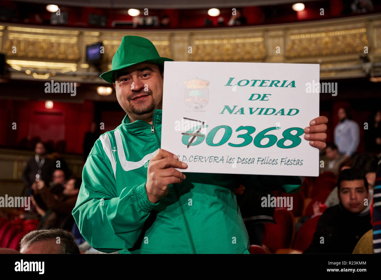 A guest seen in a color full costume holding lottery cards during the ...