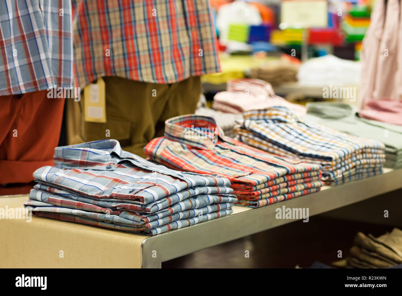 Stack shirts in clothes shop hi-res stock photography and images - Alamy