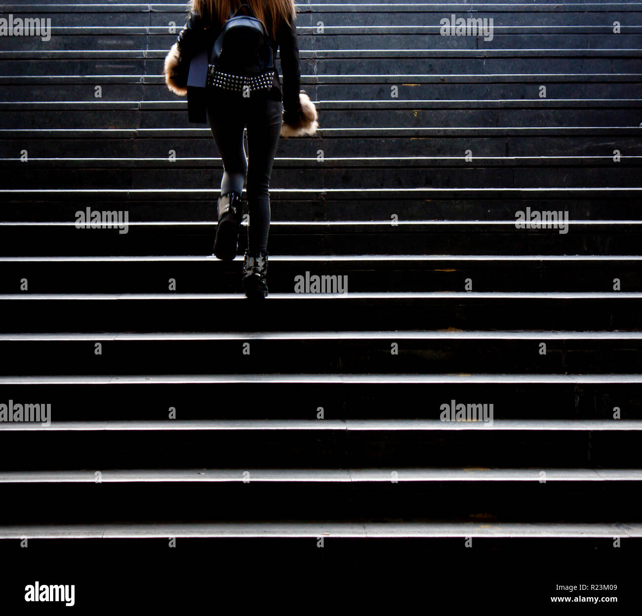 Girl climbing stairs hi-res stock photography and images - Alamy