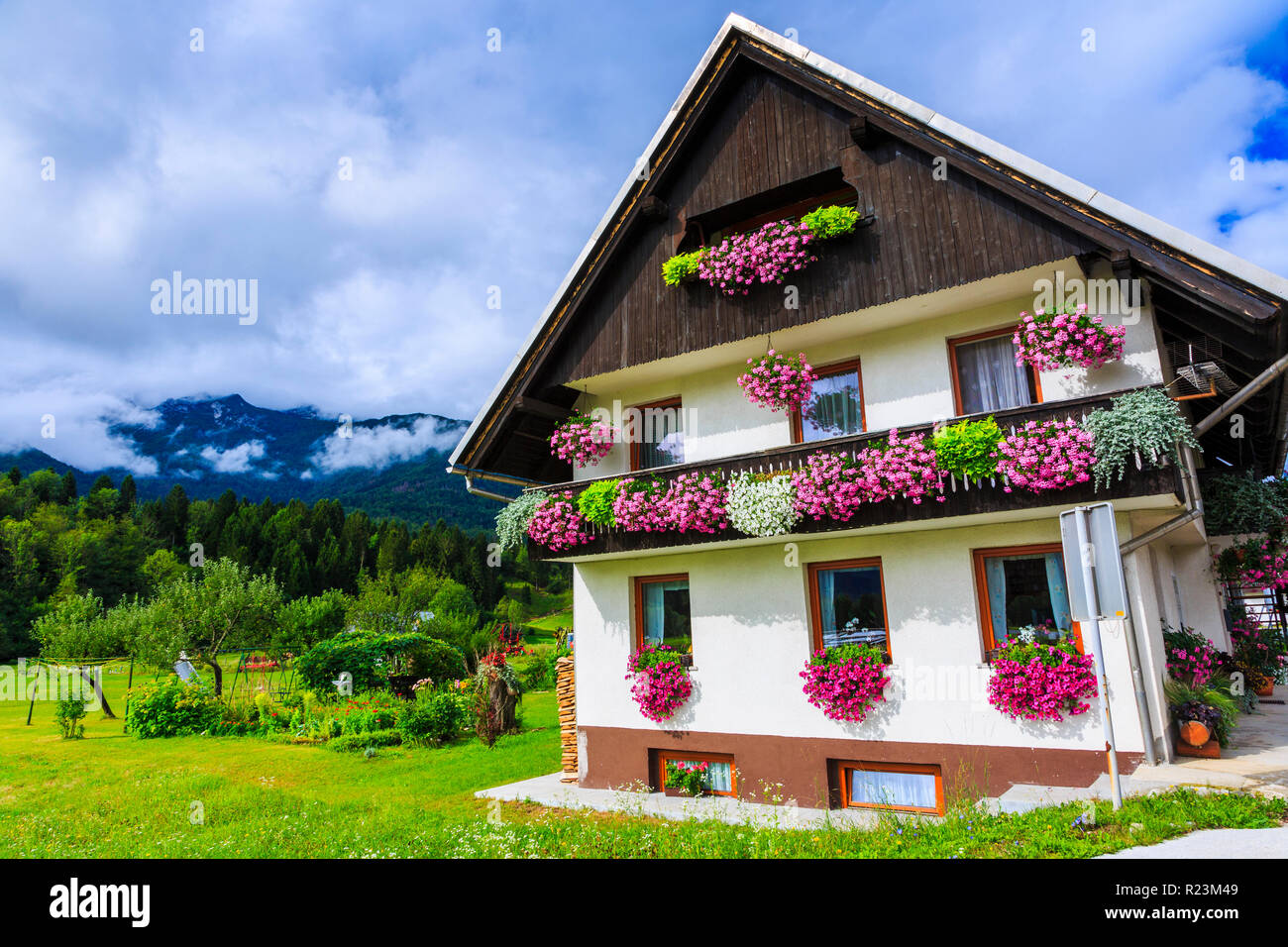 Rural house with flowers Stock Photo - Alamy