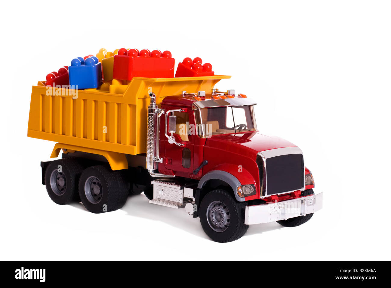 Dump track toy loaded with blocks Stock Photo - Alamy