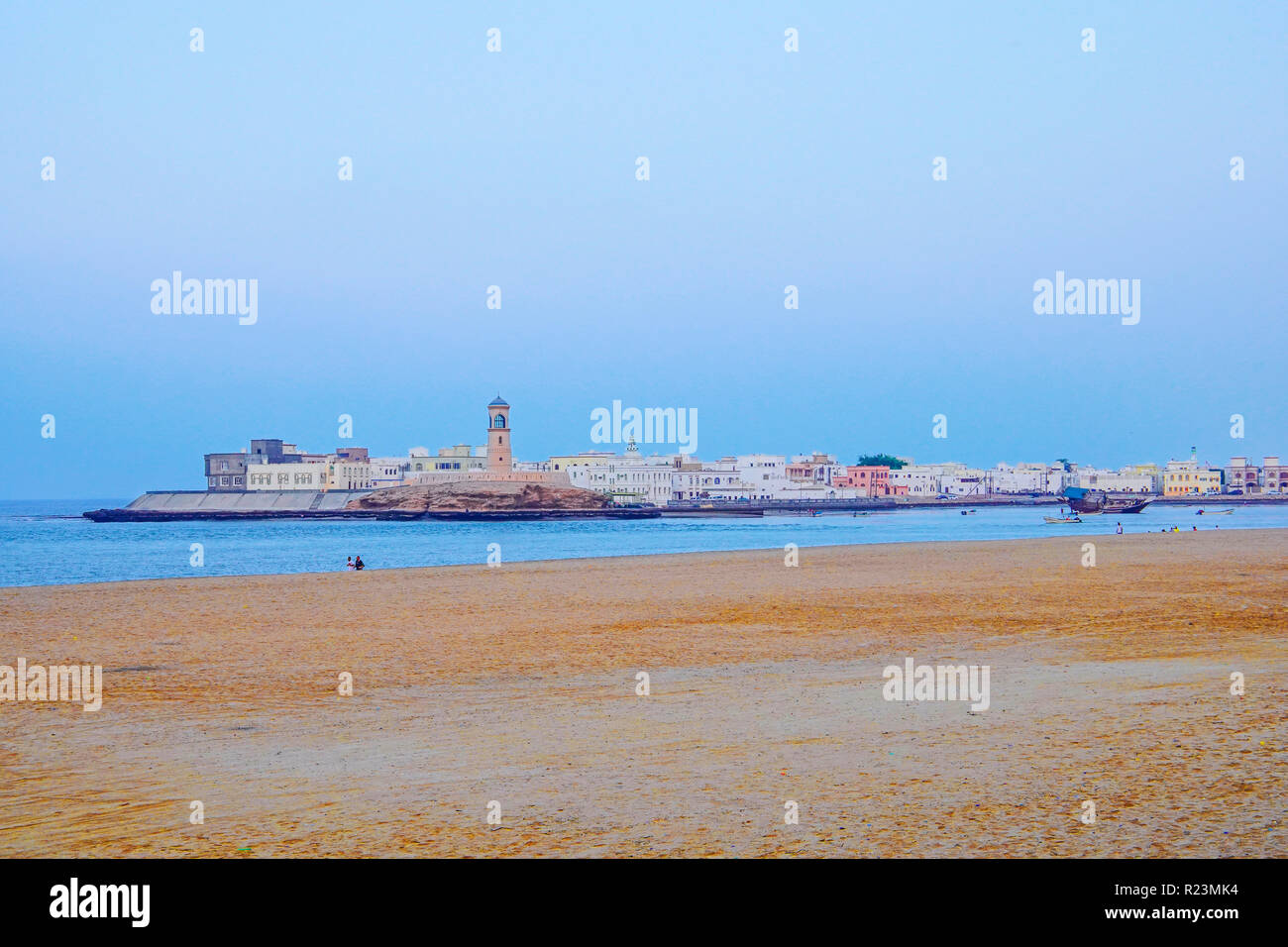 View of Al Ayjah town, lighthouse in the bay of Sur, Oman Stock Photo ...