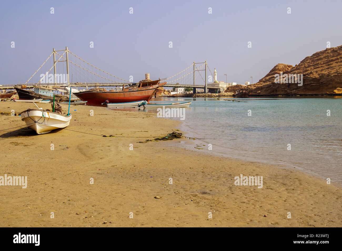 Sur town, old traditional omani wooden boat (dhow) in the harbor ...