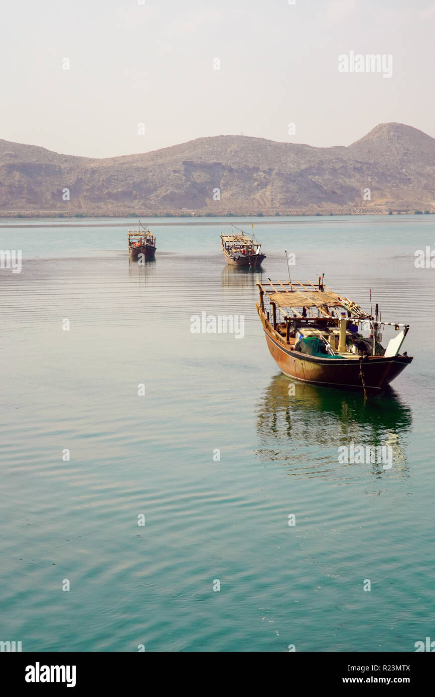 Sur town, old traditional omani wooden boat (dhow) in the harbor ...