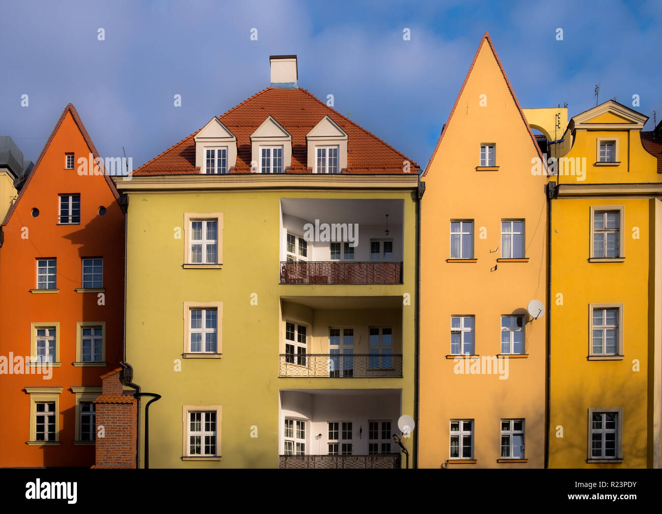 Colorful polish apartment buildings with pointy roofs. Pastel colored ...