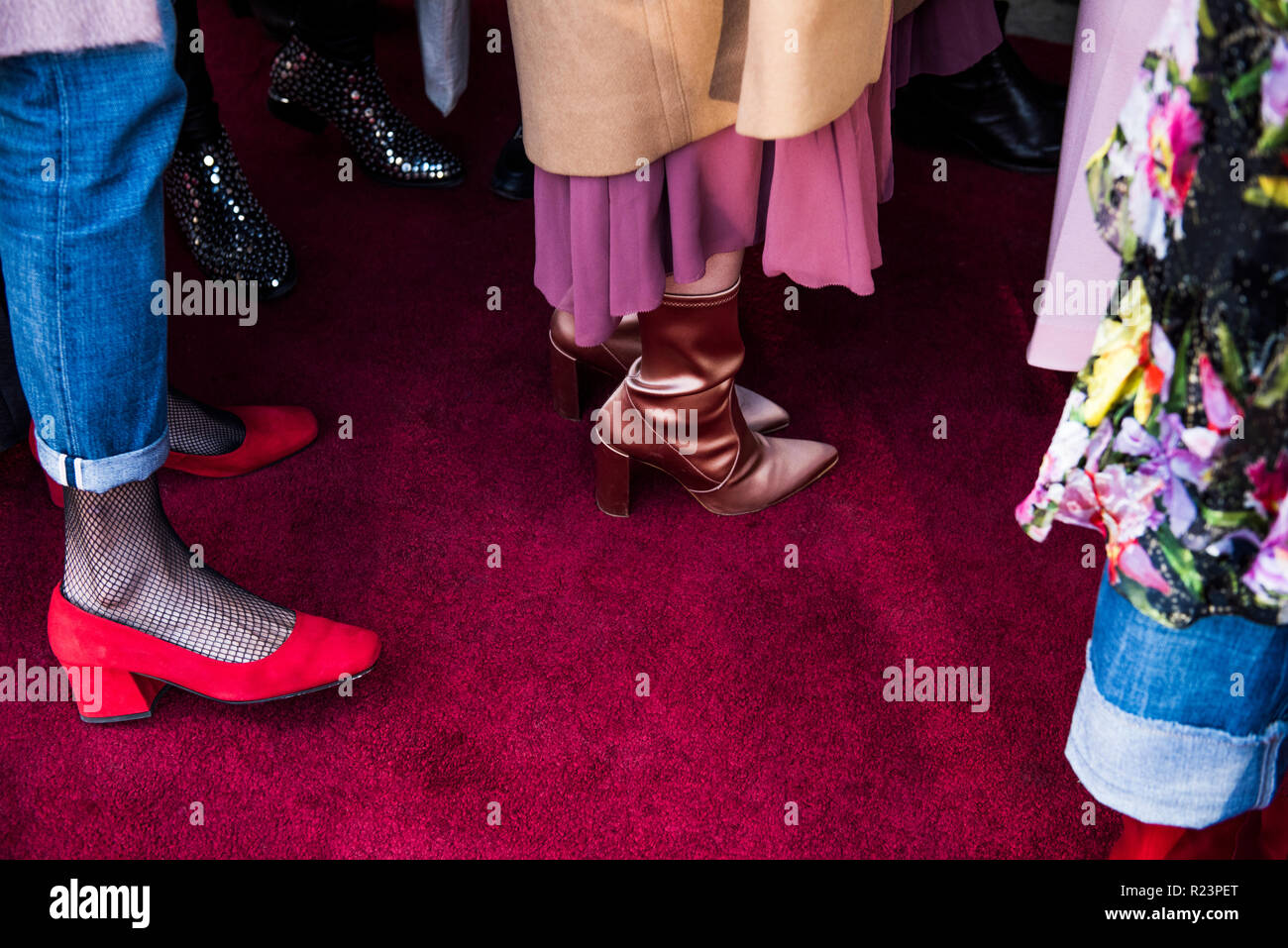 Fashionable people waiting in line on the red carpet Stock Photo - Alamy