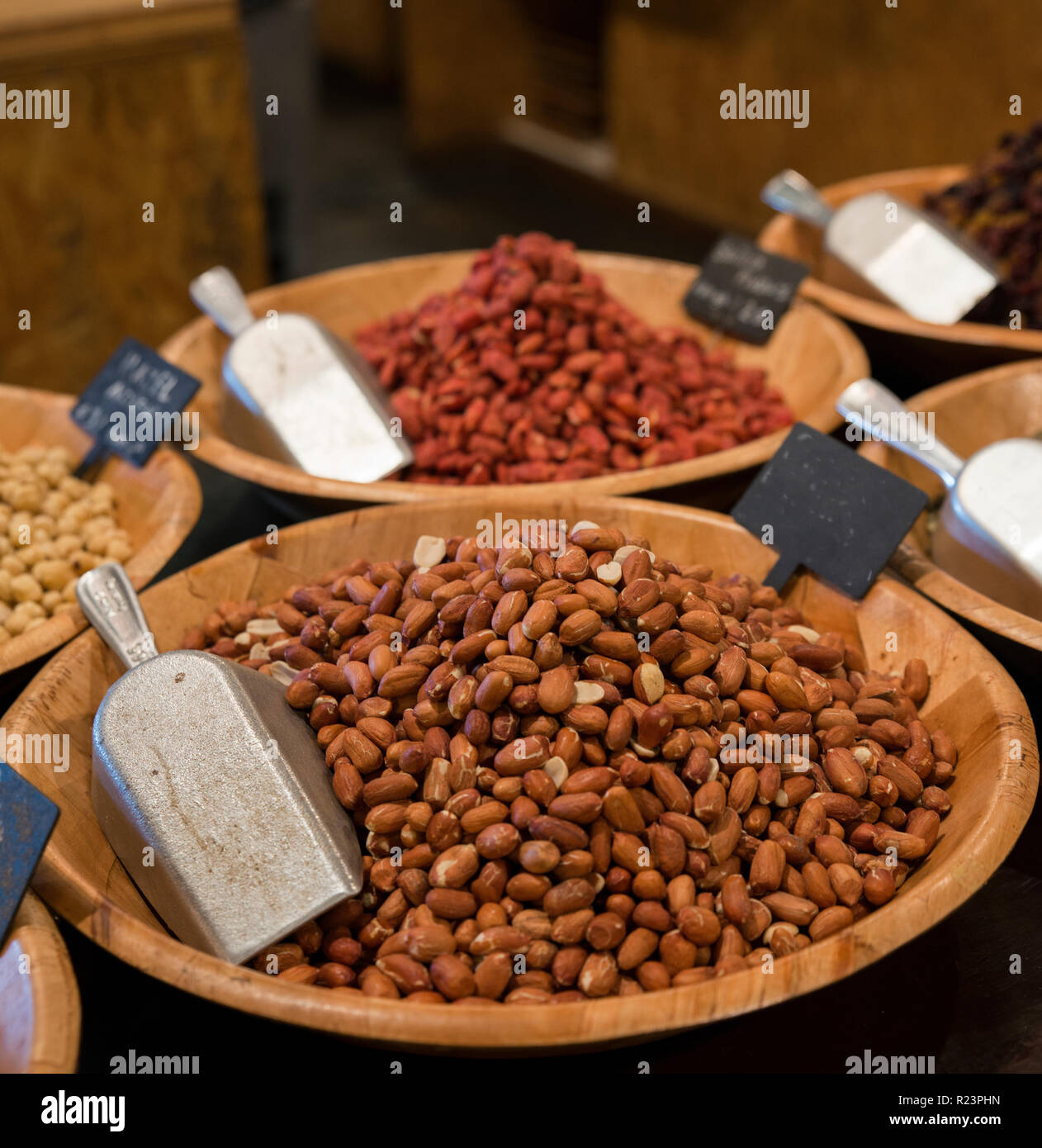 desk in a shop with peanuts walnuts hazelnuts and other nuts for ...