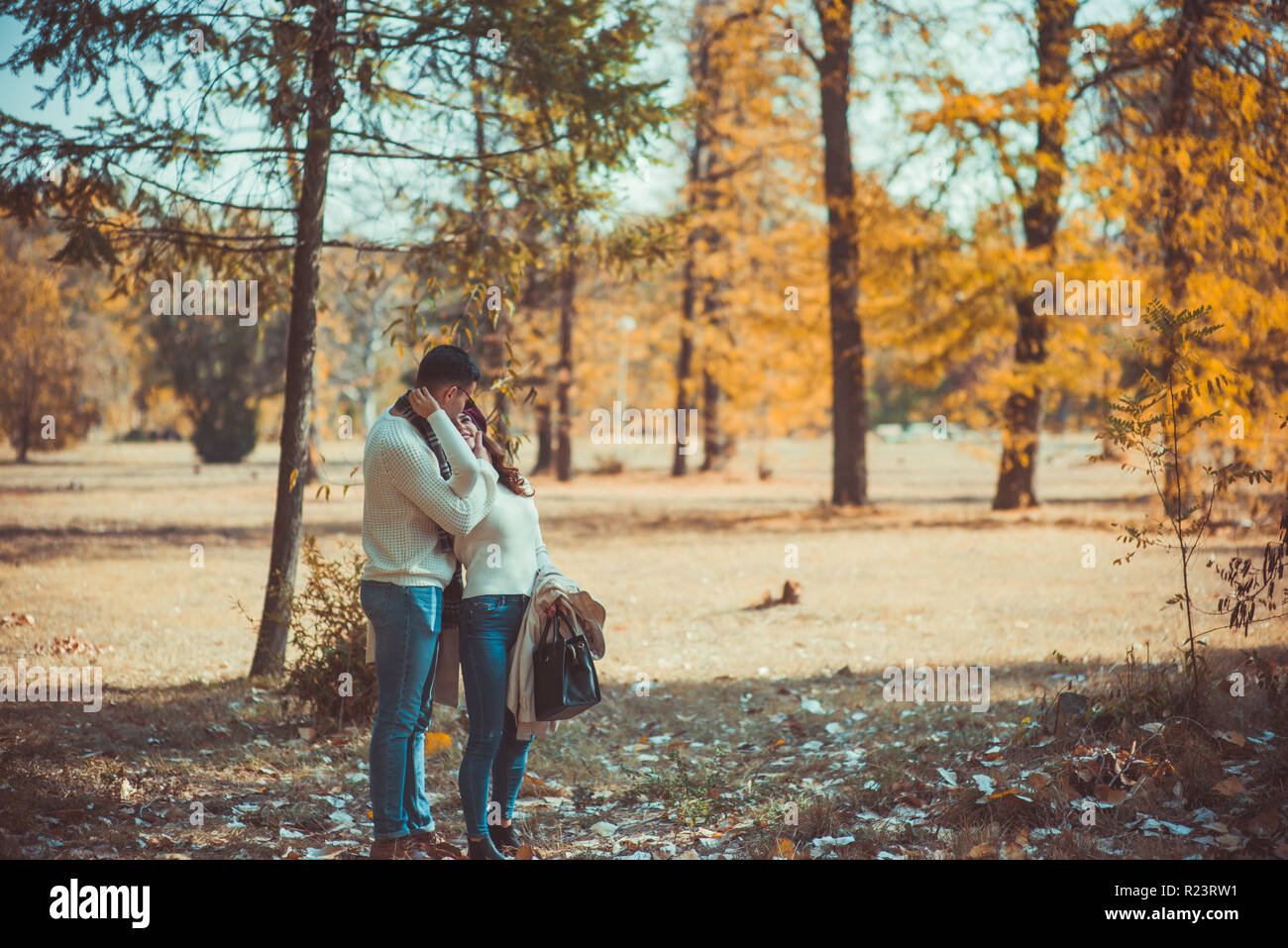 Careless couple spending carefree time in the wood, looking satisfied ...