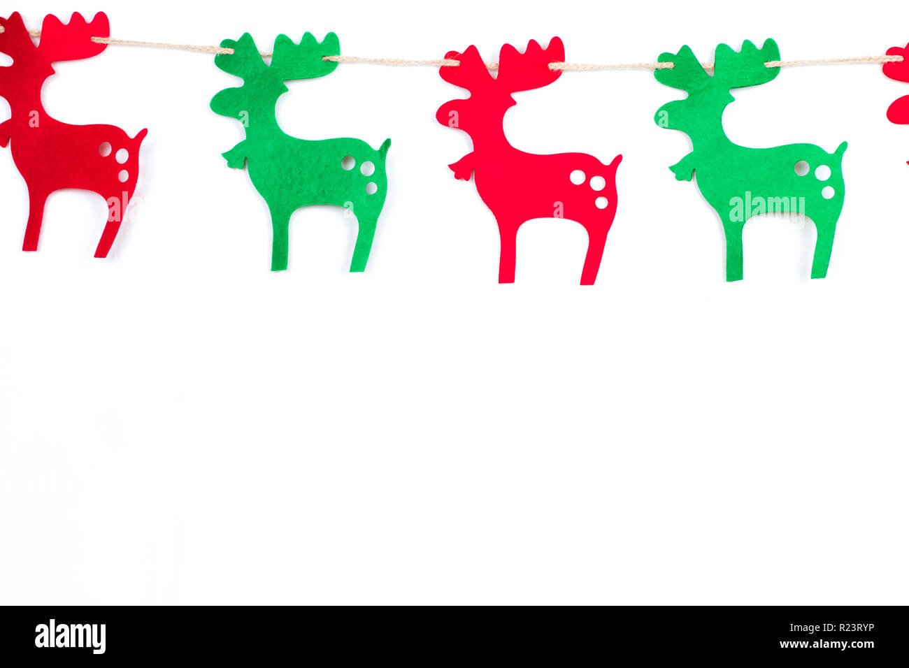 Christmas red and green reindeer in a row. Isolated on white background ...