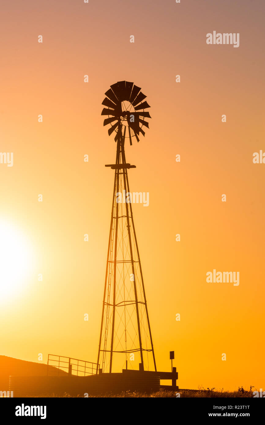 A working windmill in Colorado at sunrise Stock Photo - Alamy