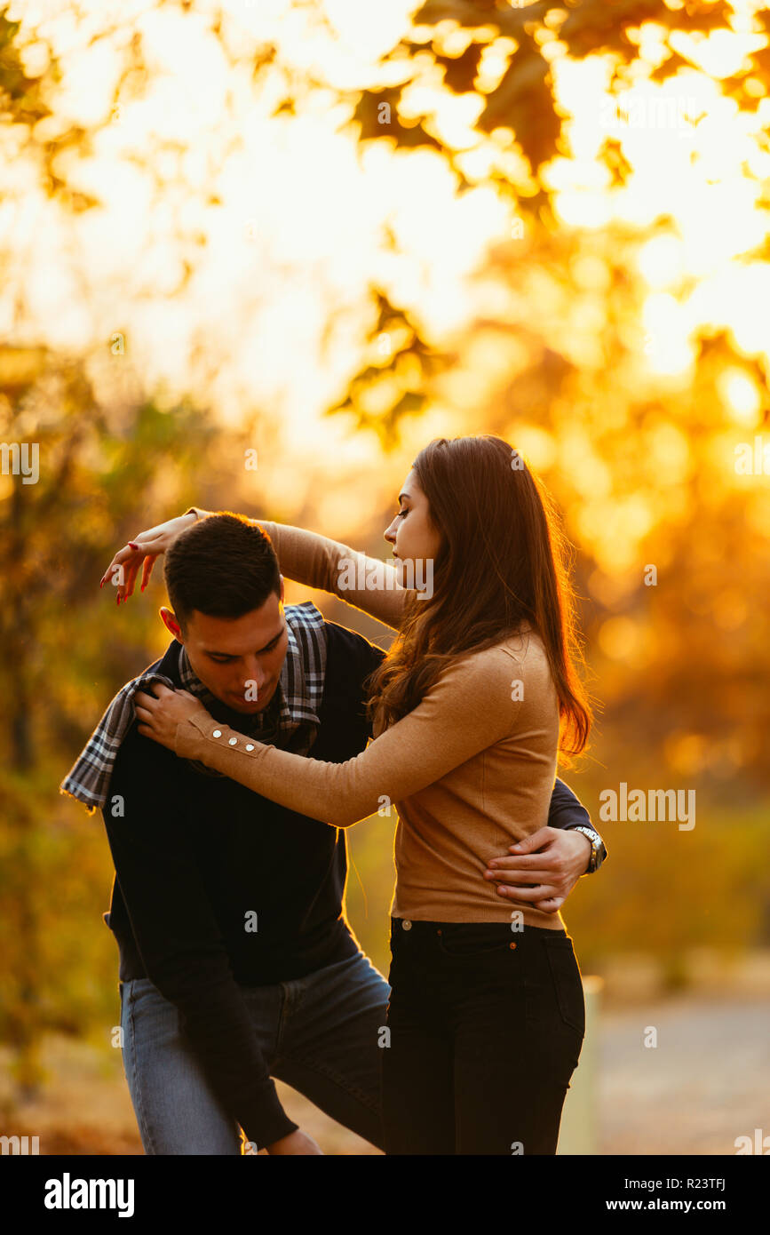 Wild boyfriend trying to take his girlfriend in his arms Stock Photo ...