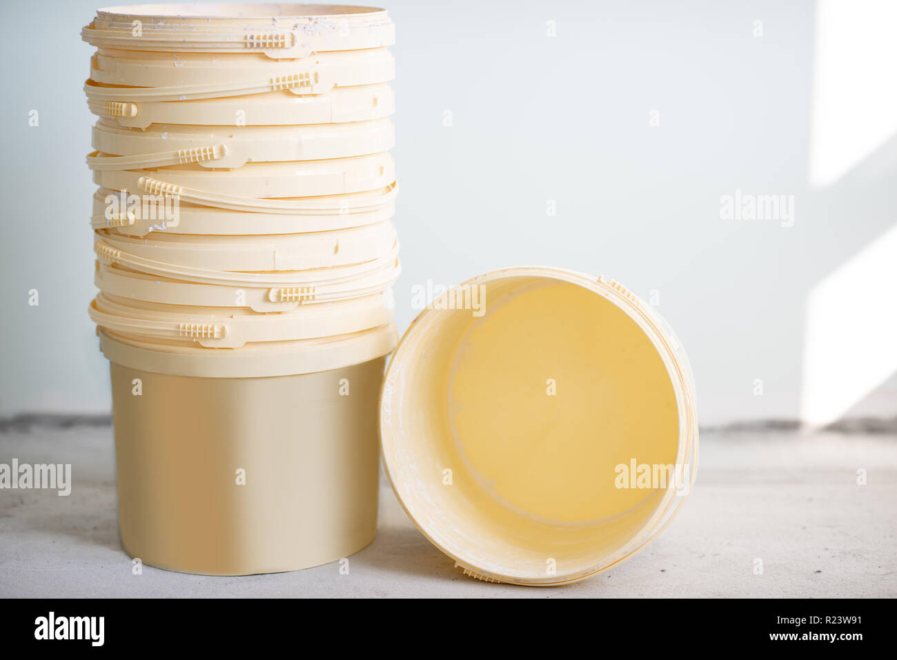 Empty building buckets at the construction site indoors Stock Photo - Alamy