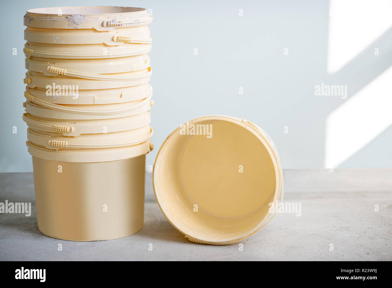 Empty building buckets at the construction site indoors Stock Photo - Alamy