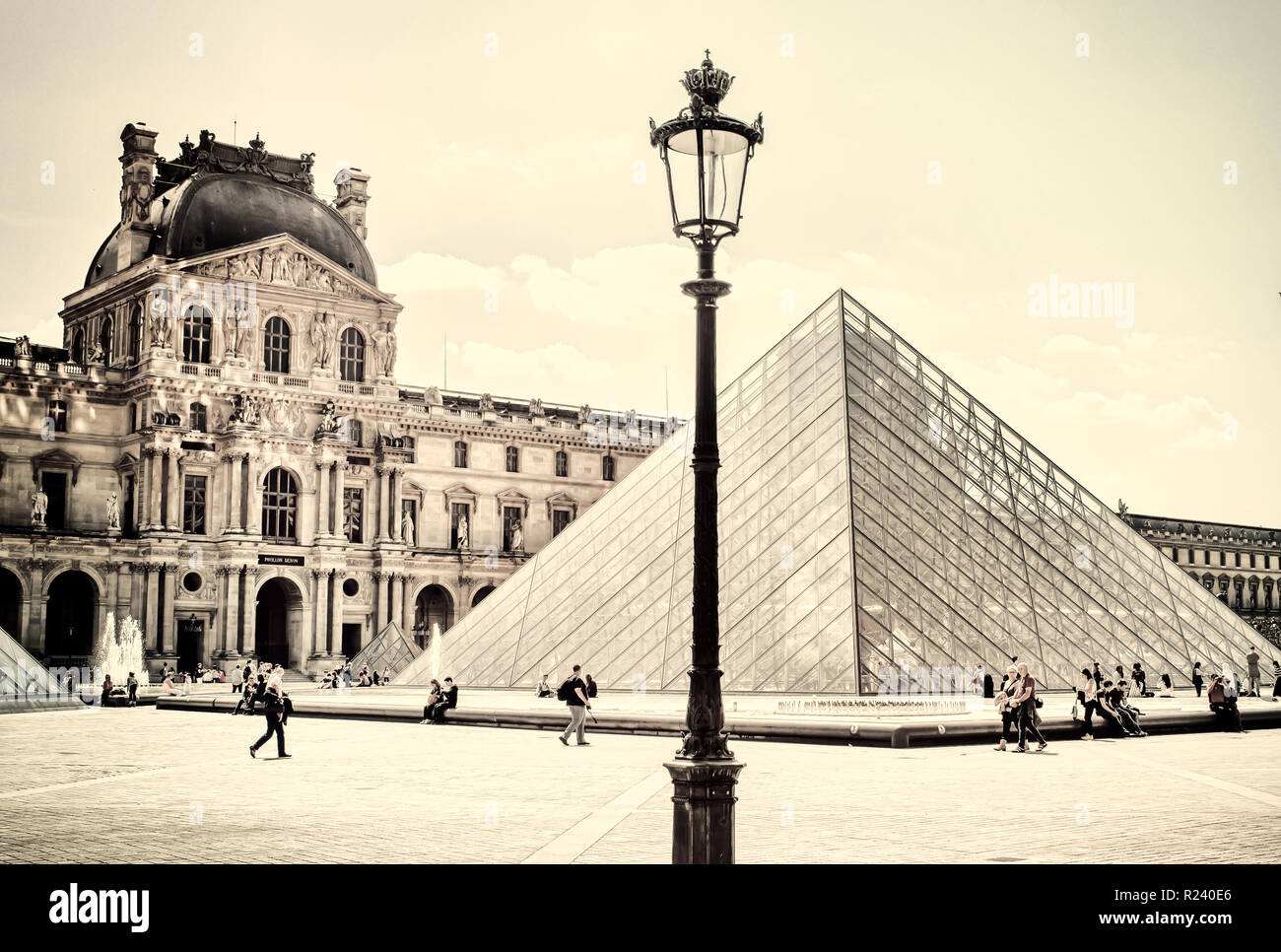 The Louvre in Paris on a sunny day. Vintage view. The Louvre in Paris ...