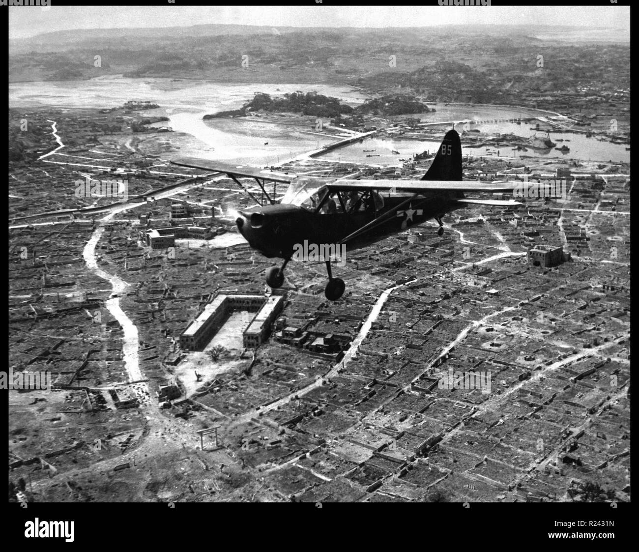 Sentinel US Air Force observation plane flies low over Naha, capital of ...