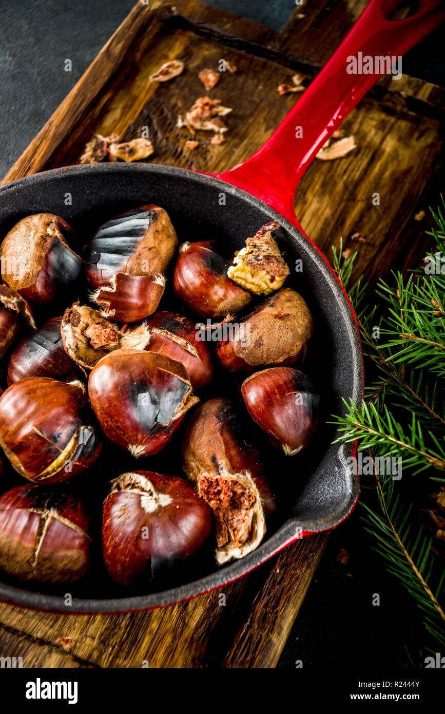 Cracked roasted chestnuts, traditional autumn winter homemade snack, on ...