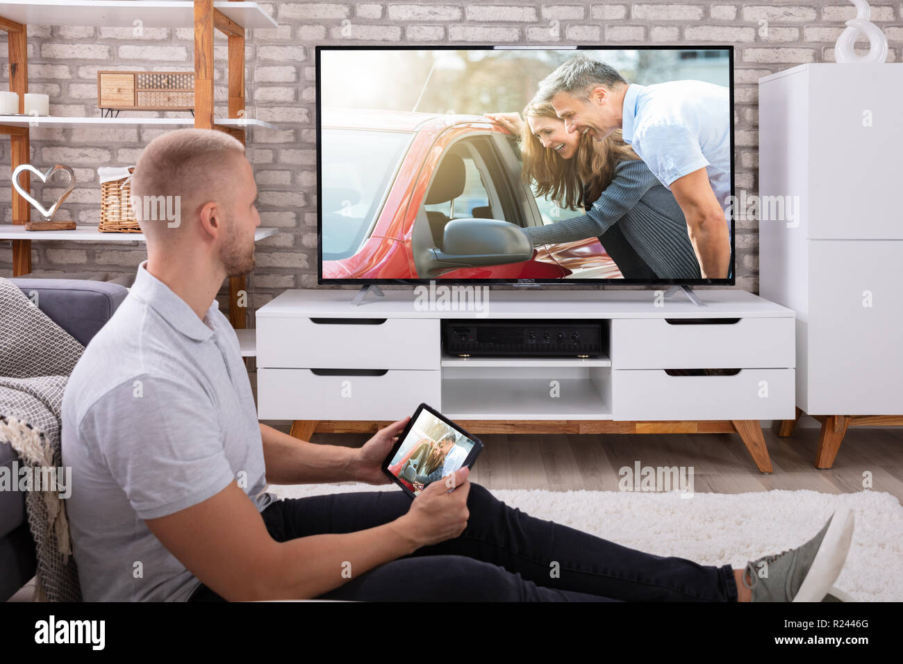 Man Streaming Television Channel Through Wireless Connection On Digital ...