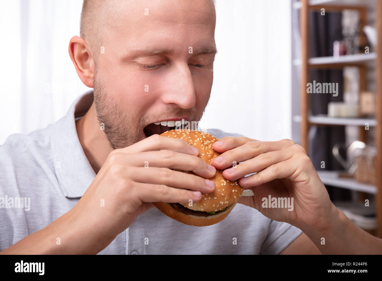 Mouth eating burger hi-res stock photography and images - Alamy