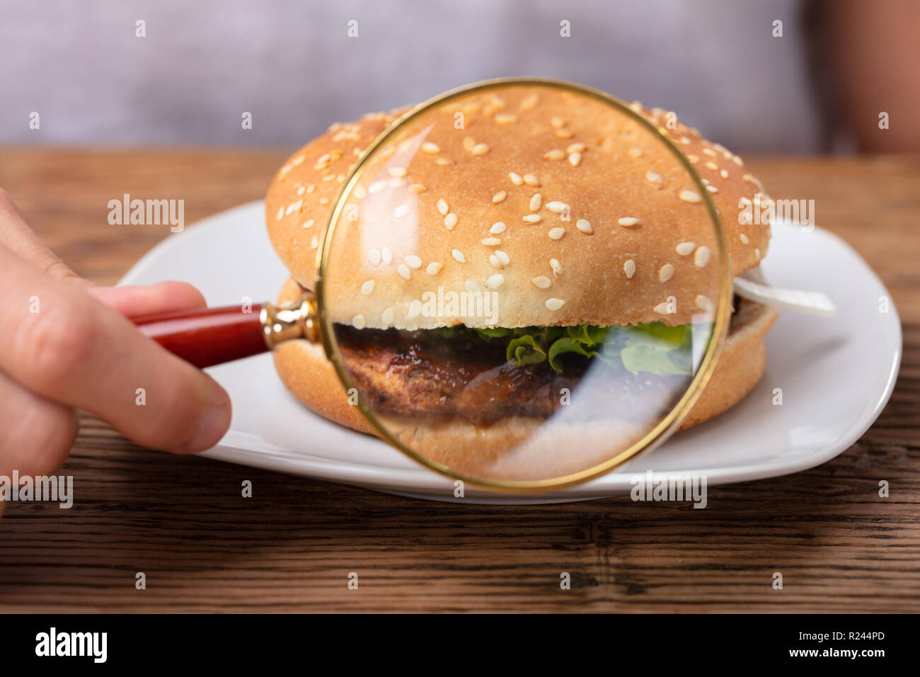 Magnifying glass examining burger hi-res stock photography and images ...