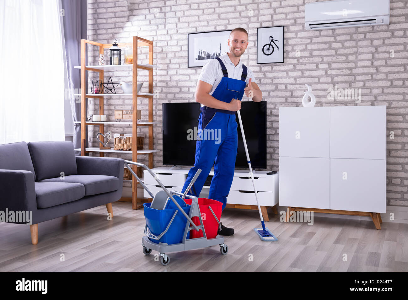 Man sofa looking up standing hi-res stock photography and images - Alamy