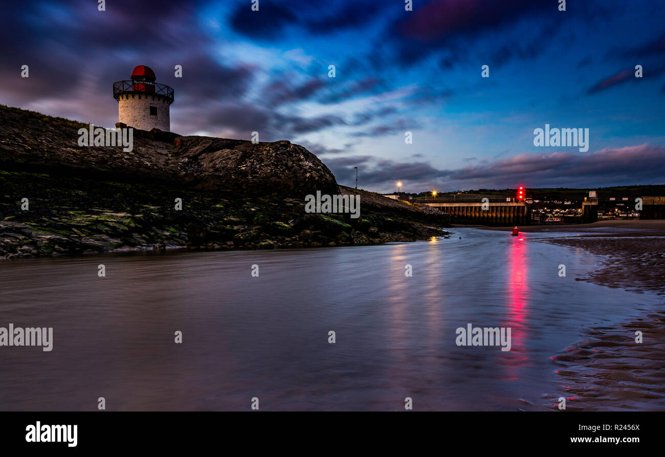 Burry Port Lighthouse, harbour traffic lights in the distance and the ...
