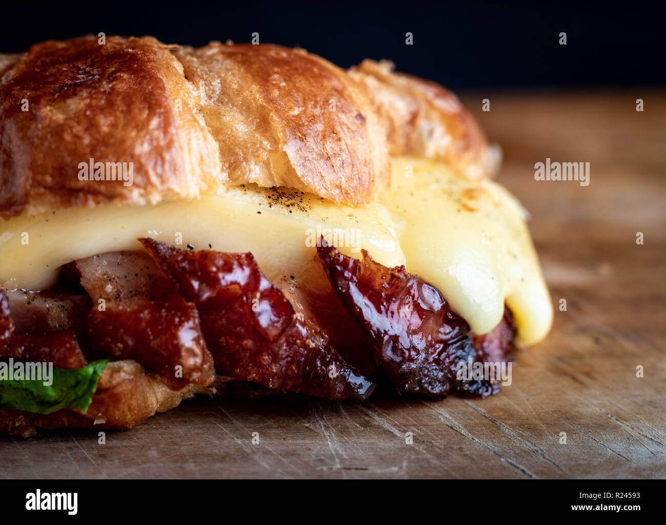 side view croissant sandwich with melted cheese and pulled pork Stock ...