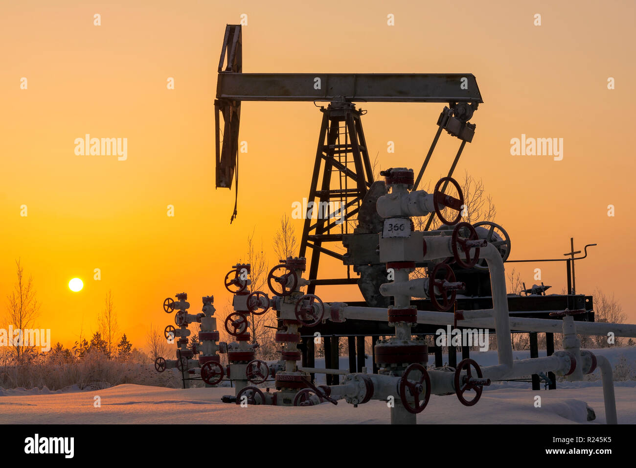 Abandoned and finished oil field in the winter period. The concept of ...
