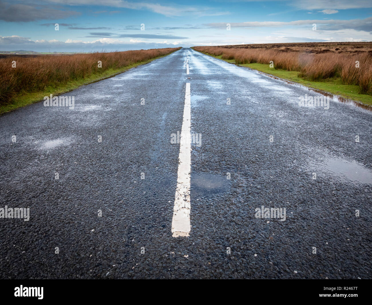 An empty, open road in wet weather in Exmoor National Park Devon UK ...