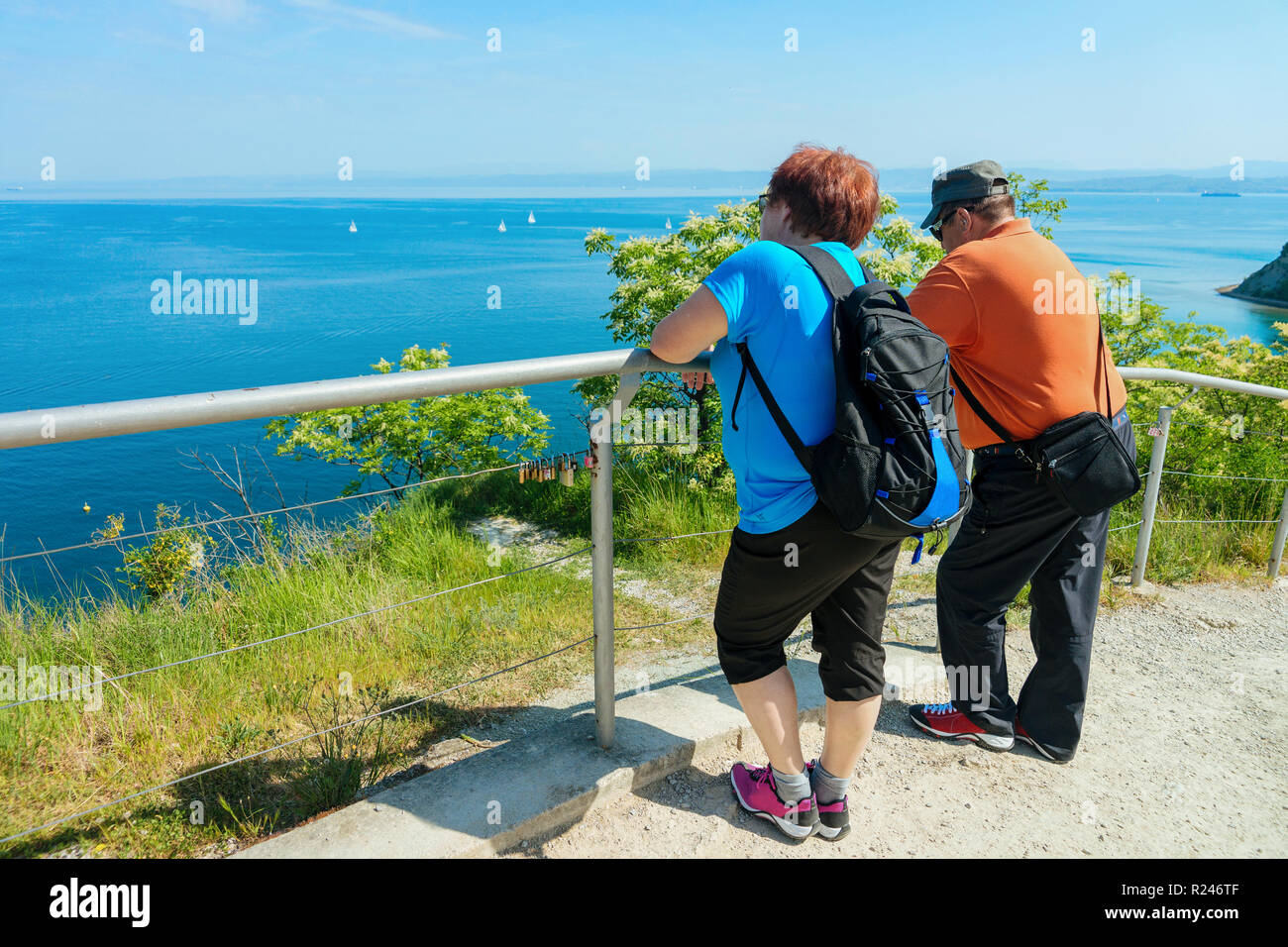 Family couple looking at the Adriatic Sea in Strunjan national Park in ...